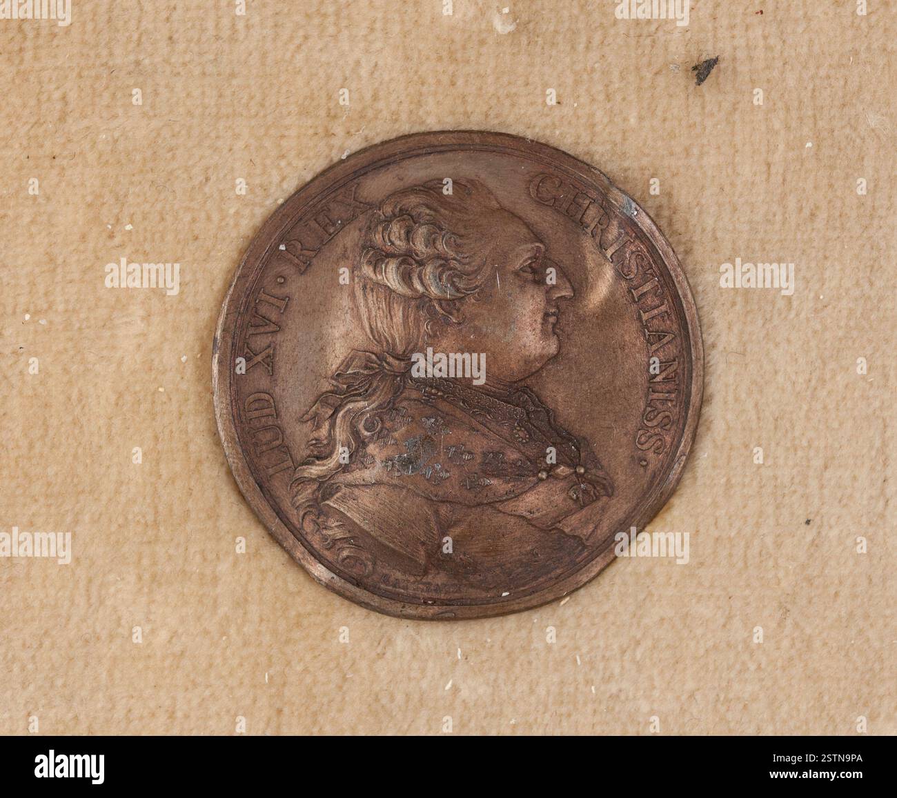 This medal features a right-facing bust of Louis XVI, dressed in a coat ...