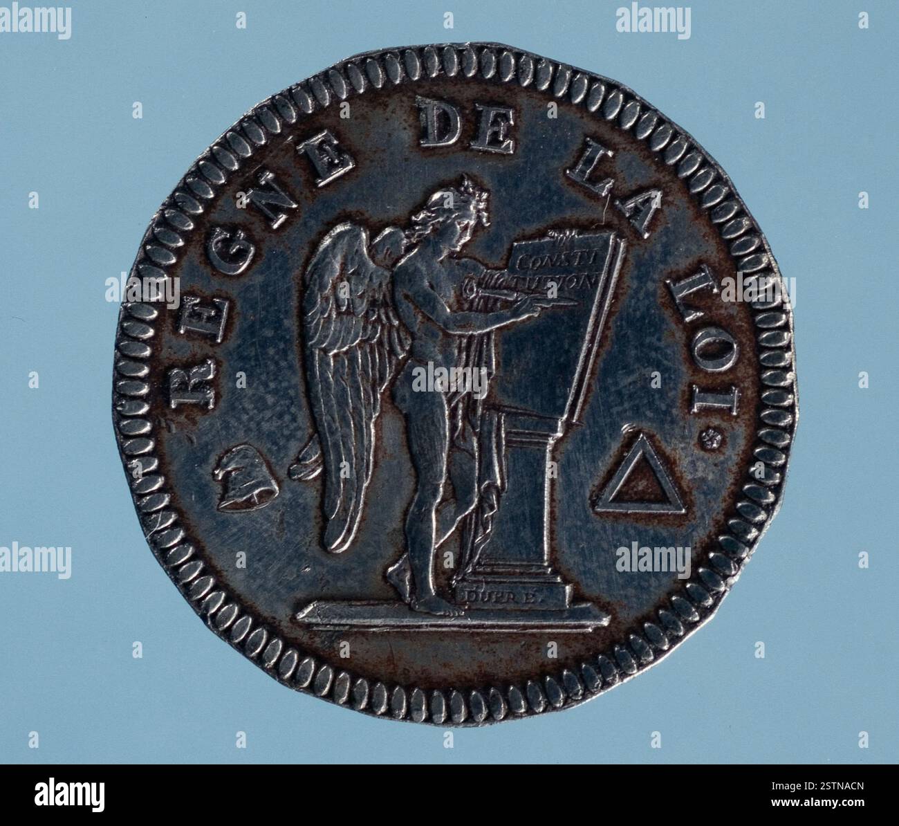 A 1791 medal by Augustin Dupré, featuring an angelic figure engraving ...