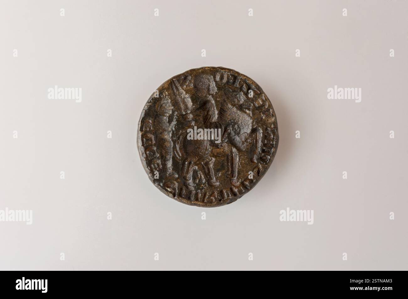 14th-century French coin featuring Saint Martin on horseback, holding a ...