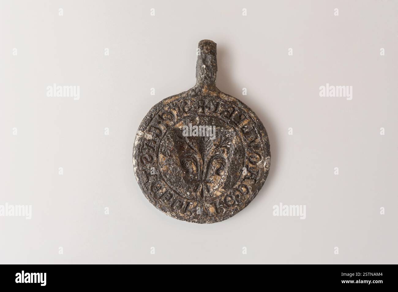 13th-century French coin featuring a fleur-de-lis symbol, a classic ...