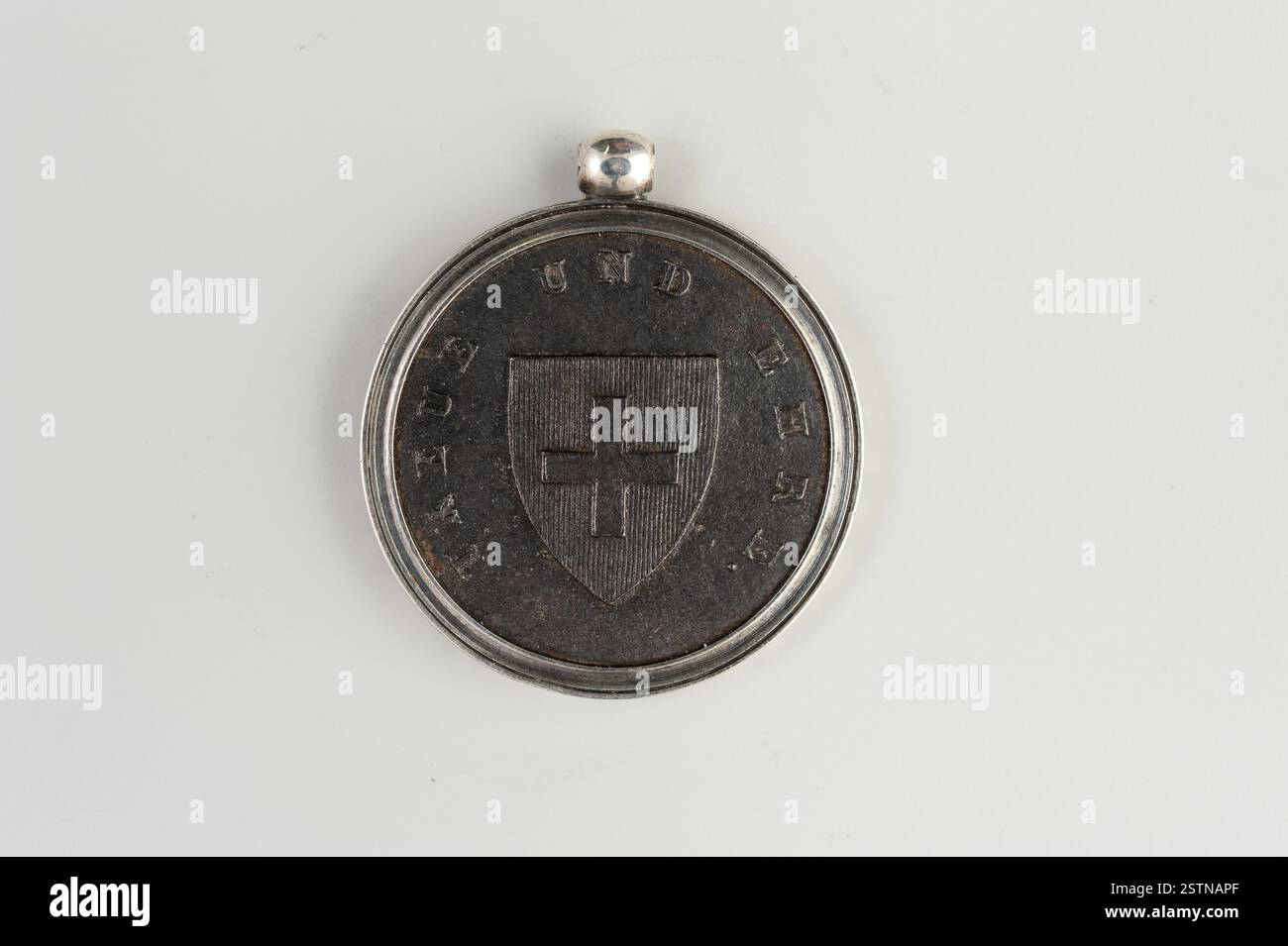 1792 medal featuring a shield with the arms of Switzerland. The reverse ...