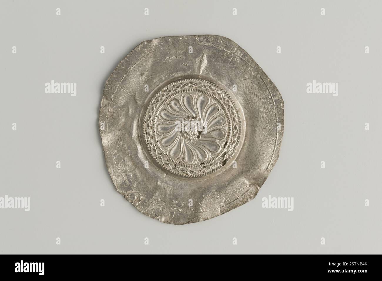 A 1788 medal by Augustin Dupré depicting a round button with a helical ...