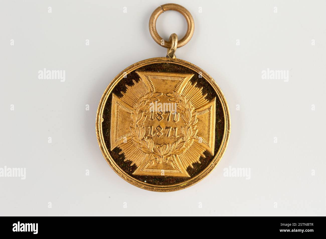 1871 medal featuring a radiant Iron Cross with a laurel wreath at its ...