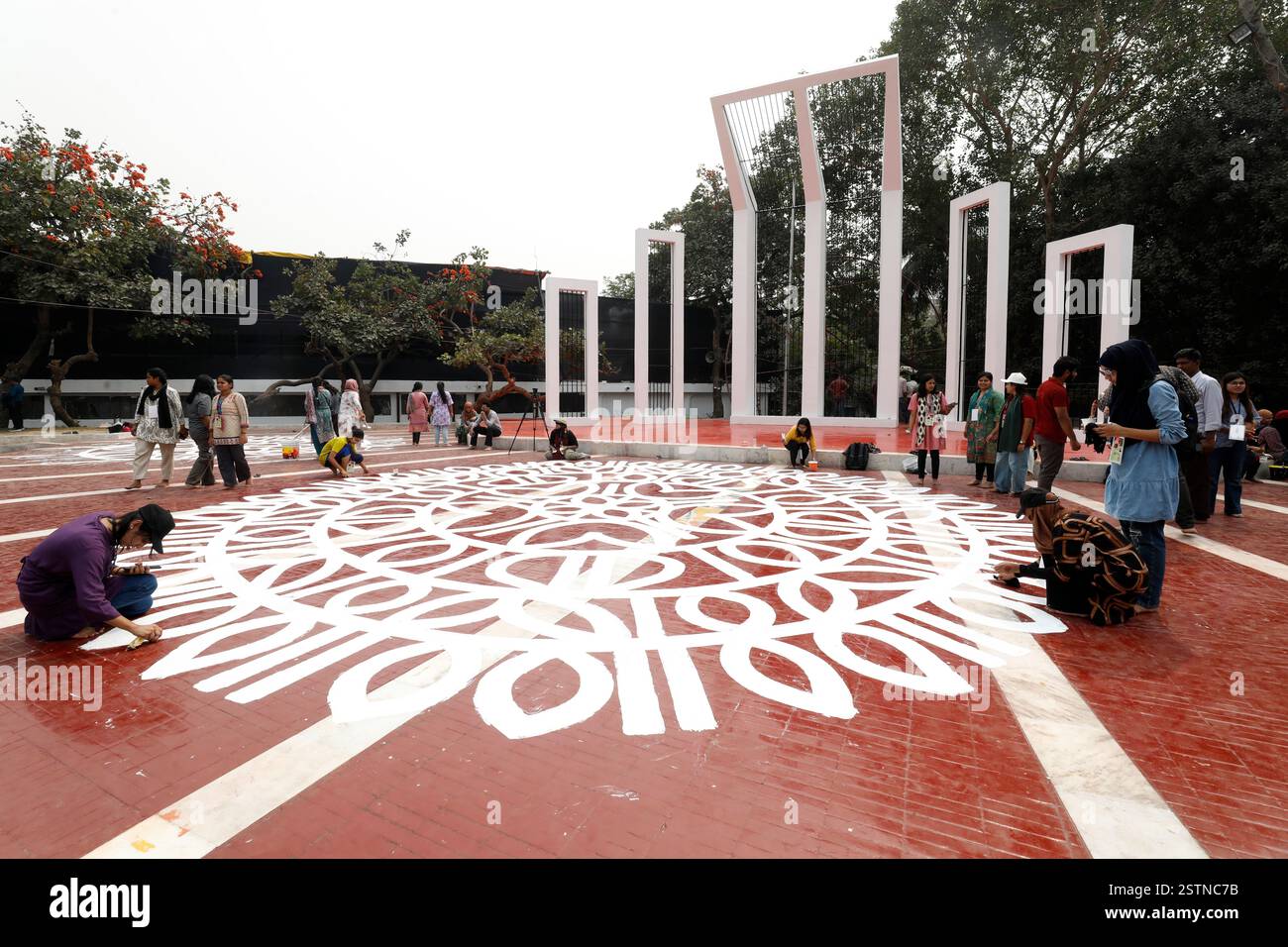 Dhaka, Bangladesh - February 19, 2024: Students are painting a mural at the Central Shaheed ...