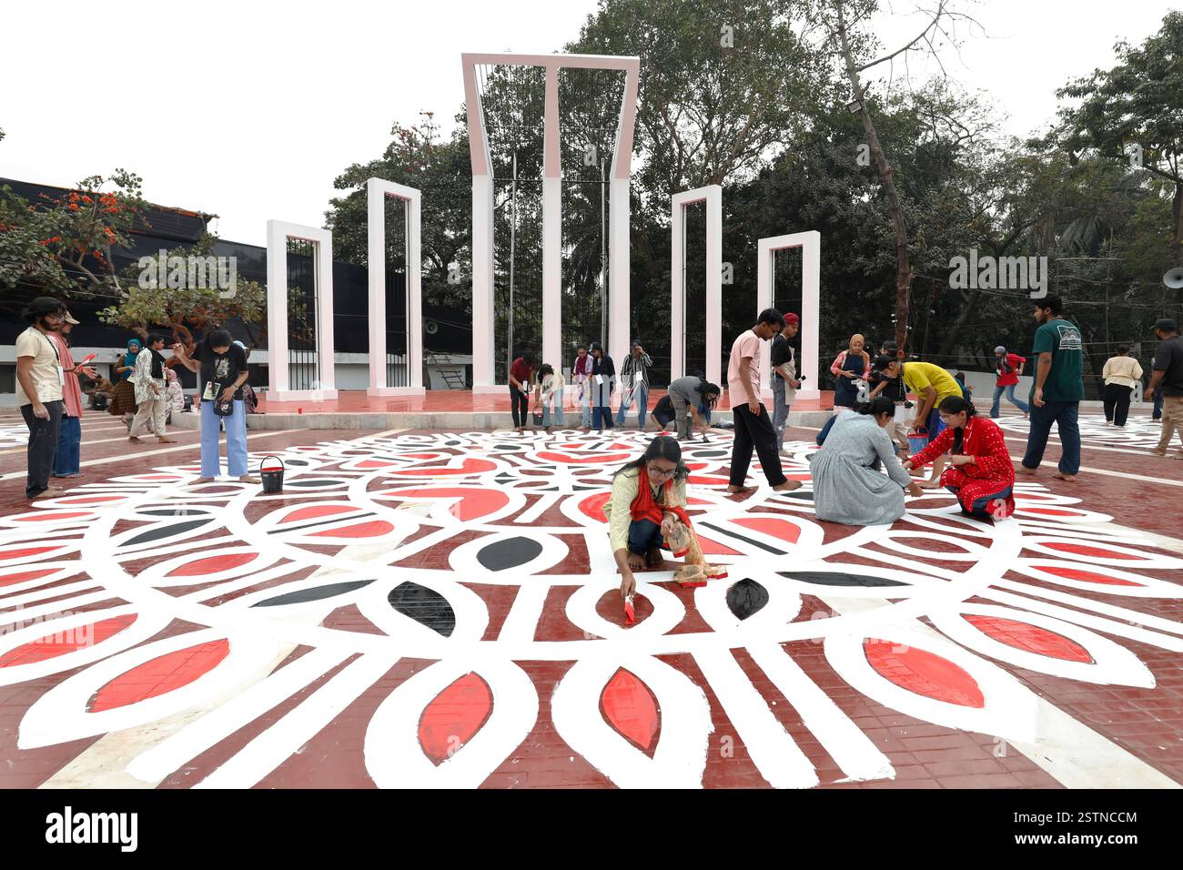 Dhaka, Bangladesh - February 19, 2024: Students are painting a mural at the Central Shaheed ...