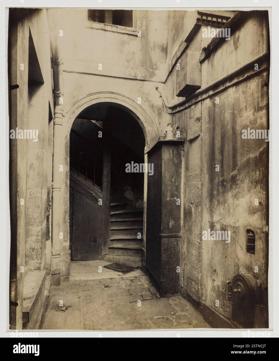 A 1910 photograph by Eugène Atget of the old courtyard at 8 Rue Honoré ...