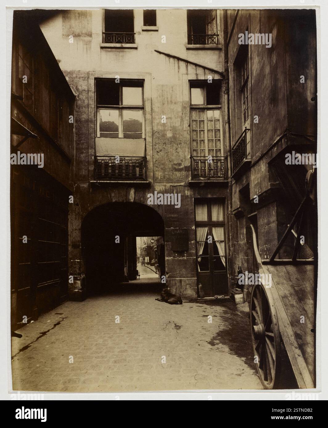 A 1911 photograph by Eugène Atget of the entrance to Passage des Singes ...