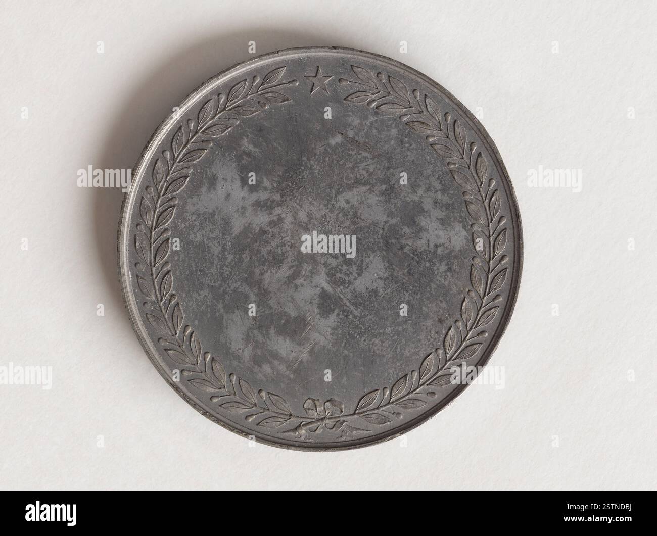 An 1806 medal by Hugues Bovy featuring a right-facing bust of Minerva ...