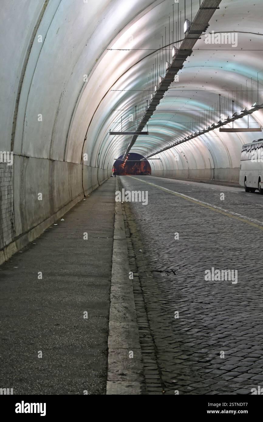 Tunnel with two lane road and sidewalk in rome hi-res stock photography ...