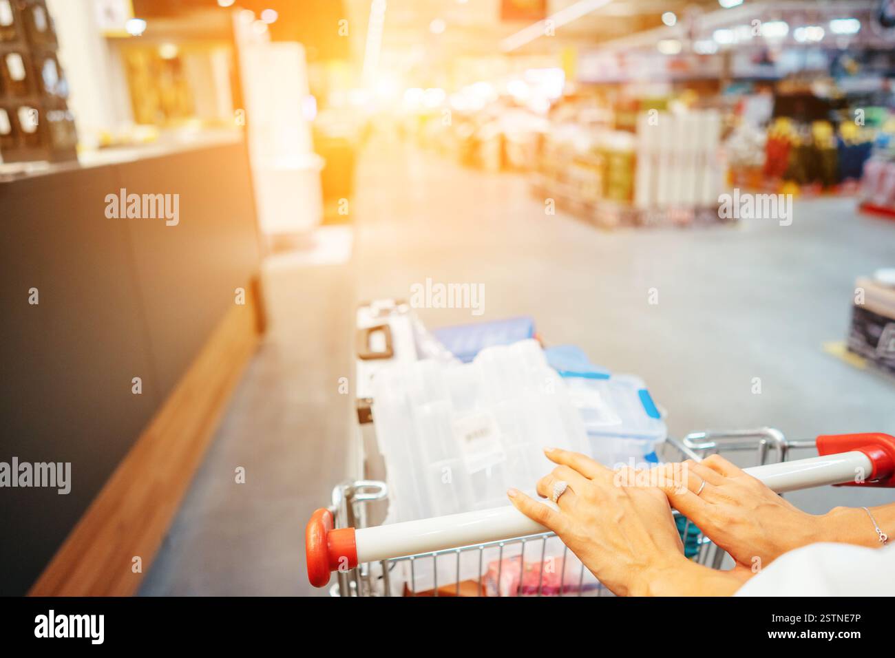 Human Hand Close Up With Shopping Cart in a Supermarket Walking Trough ...