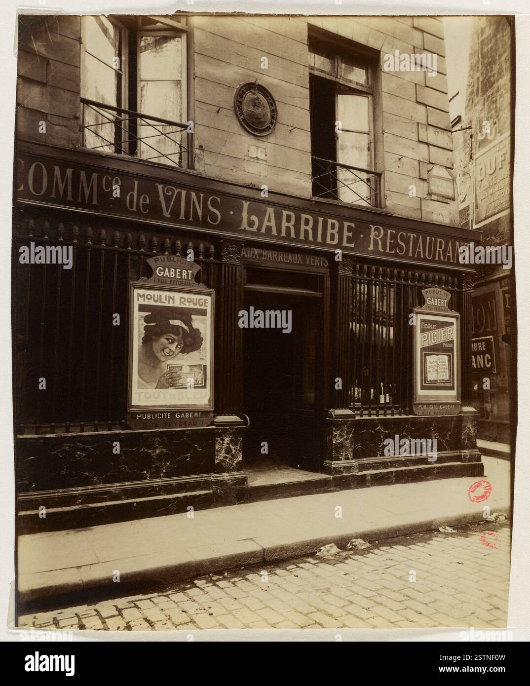 Photograph by Eugène Atget, capturing a scene from old Paris. The image ...