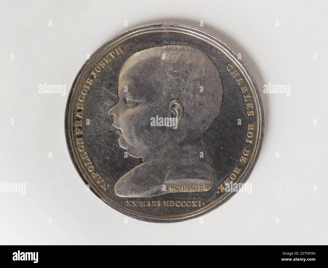 A 19th-century photograph by René Audra, showcasing a medal of the King ...