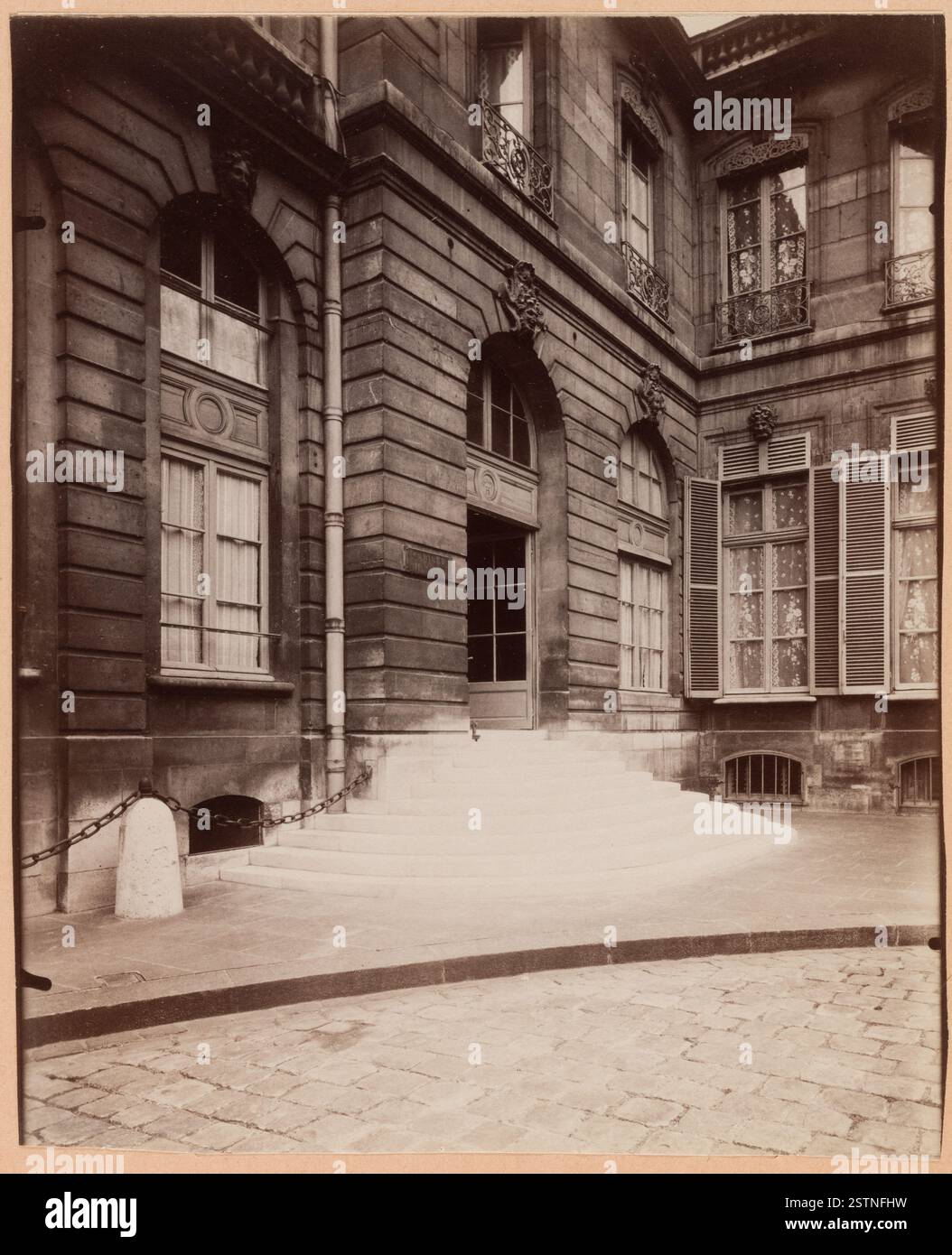 Vintage photograph by Eugène Atget showing a Parisian street, captured ...