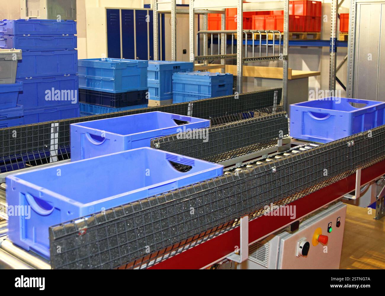 Plastic crates at conveyor rollers in factory production hi-res stock ...