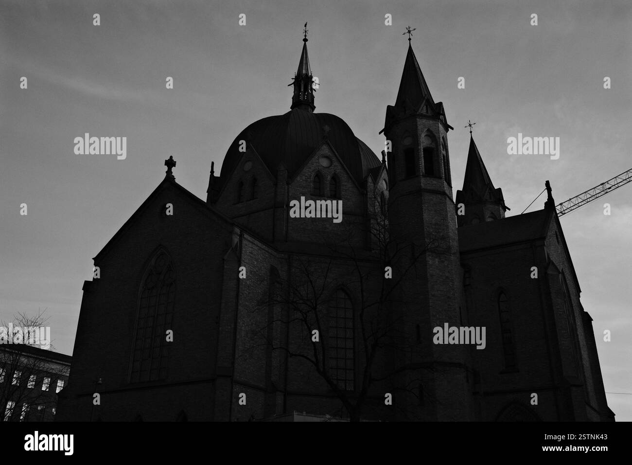 A stunning gothic church silhouette against a dusky sky, highlighting ...