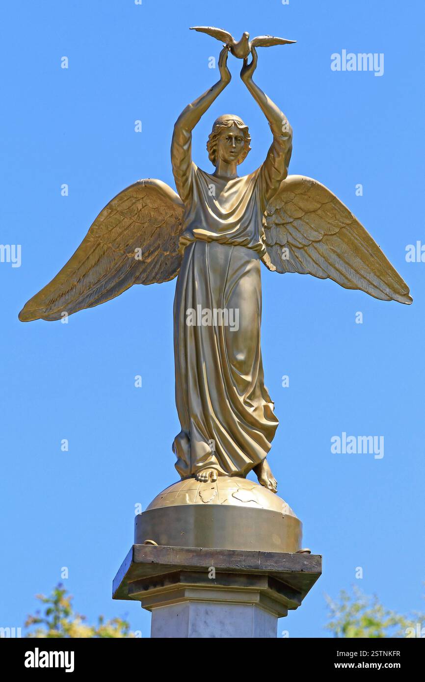 Winged golden lady holding dove statue in stratoni hi-res stock ...
