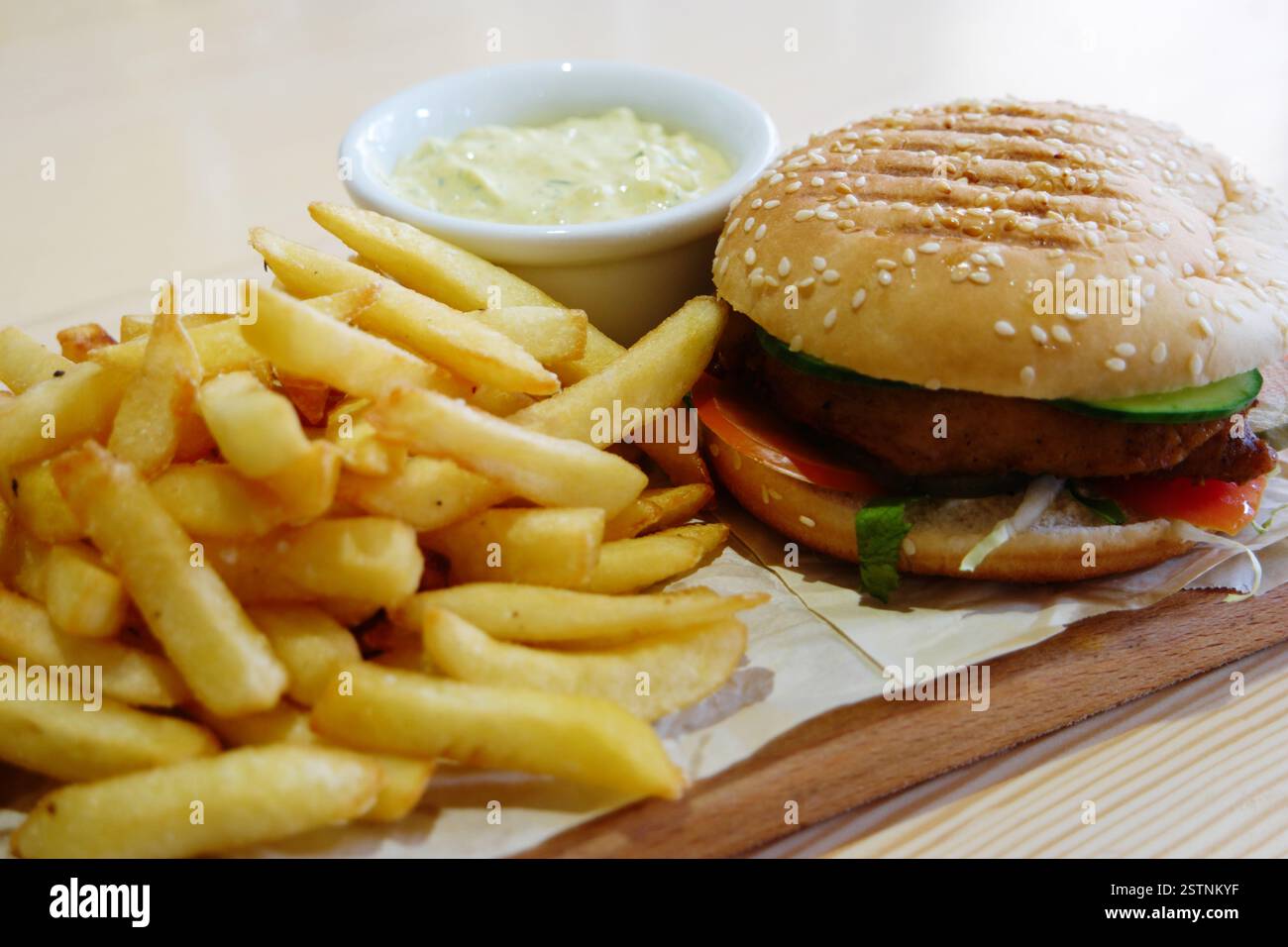 Small hamburger, french fryes and bowl of souse Stock Photo - Alamy