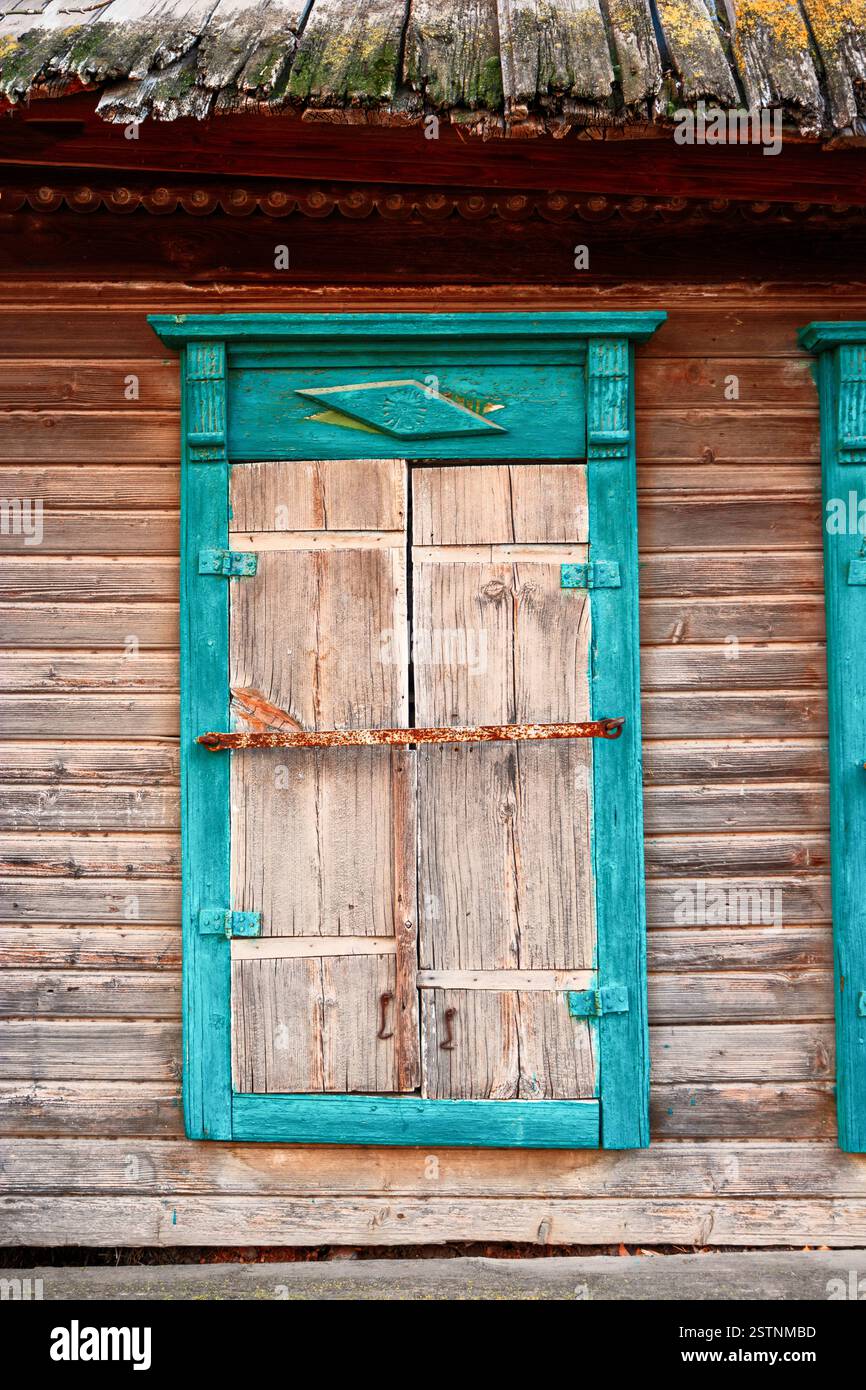 Wooden window in old Russian style painted in green by perimeter Stock ...