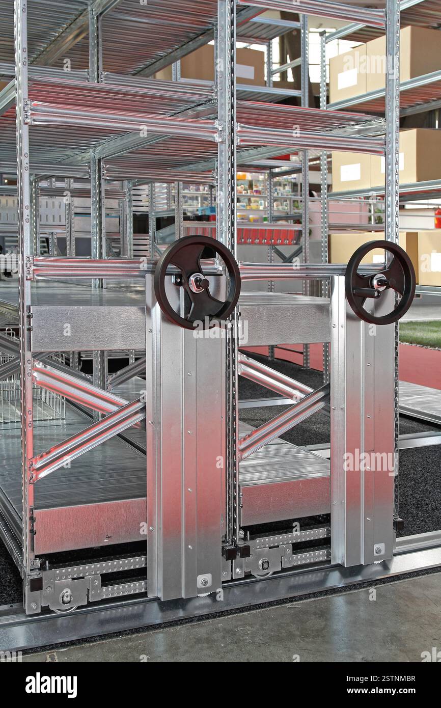 Hand crank movable metal shelving system in storage room hi-res stock ...