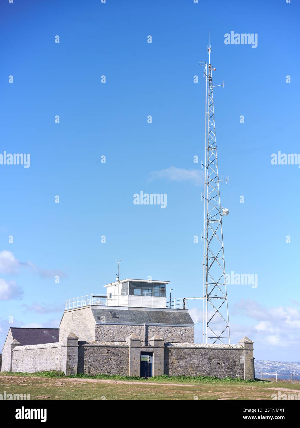 Radio aerial mast at the former powder magazine on Berry Head headland ...