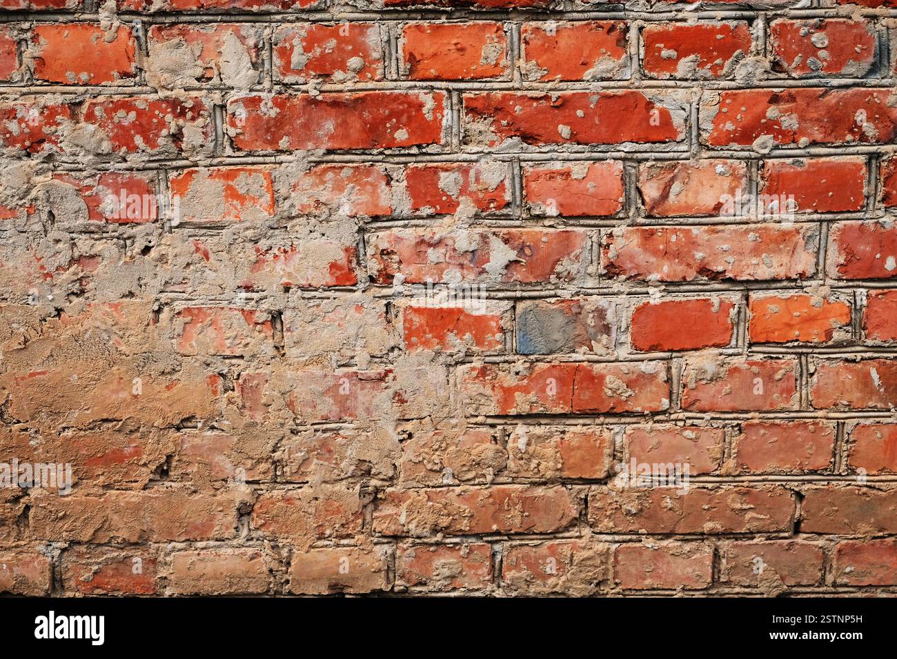 Weathered Stained Old Brick Wall half plastered Stock Photo - Alamy