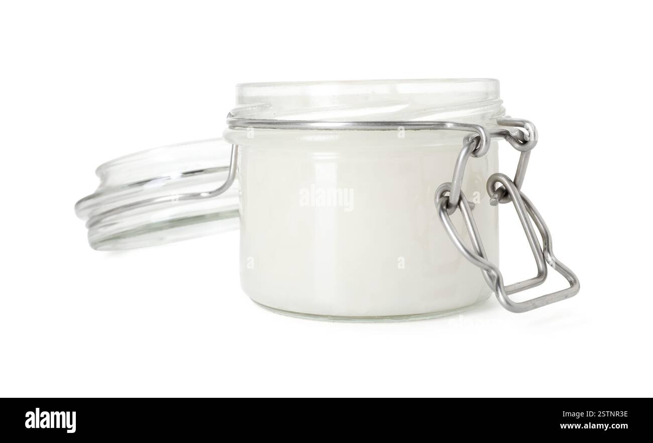 Organic coconut cooking oil in glass jar isolated on white Stock Photo ...