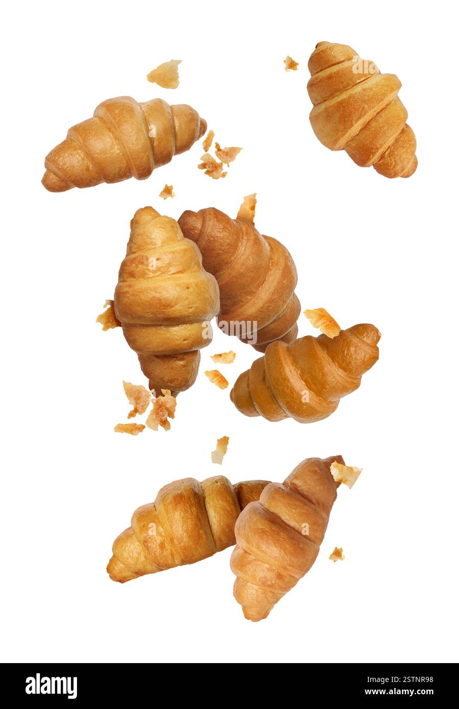 Delicious croissants and crumbs in air on white background. Puff pastry ...