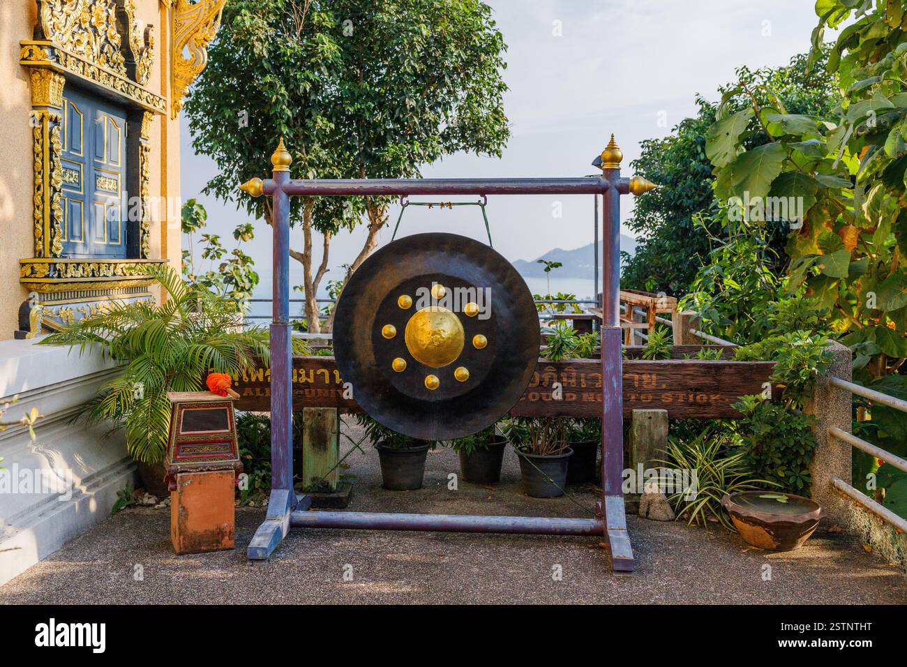 Buddhist temple gong with gold accents displayed on a metal frame at ...