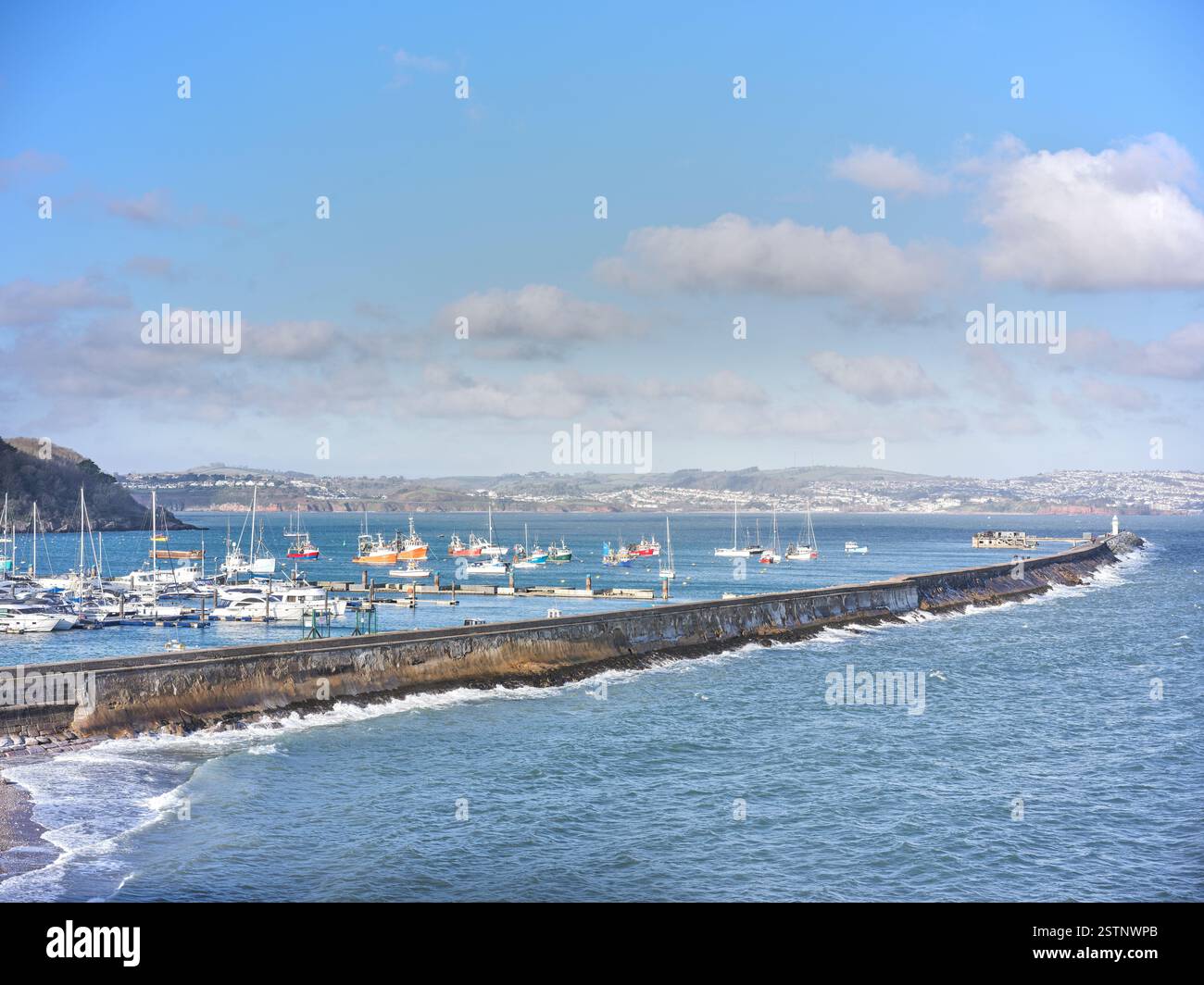 Breakwater beach, pier and harbour at Brixham fish town, Devon, England ...