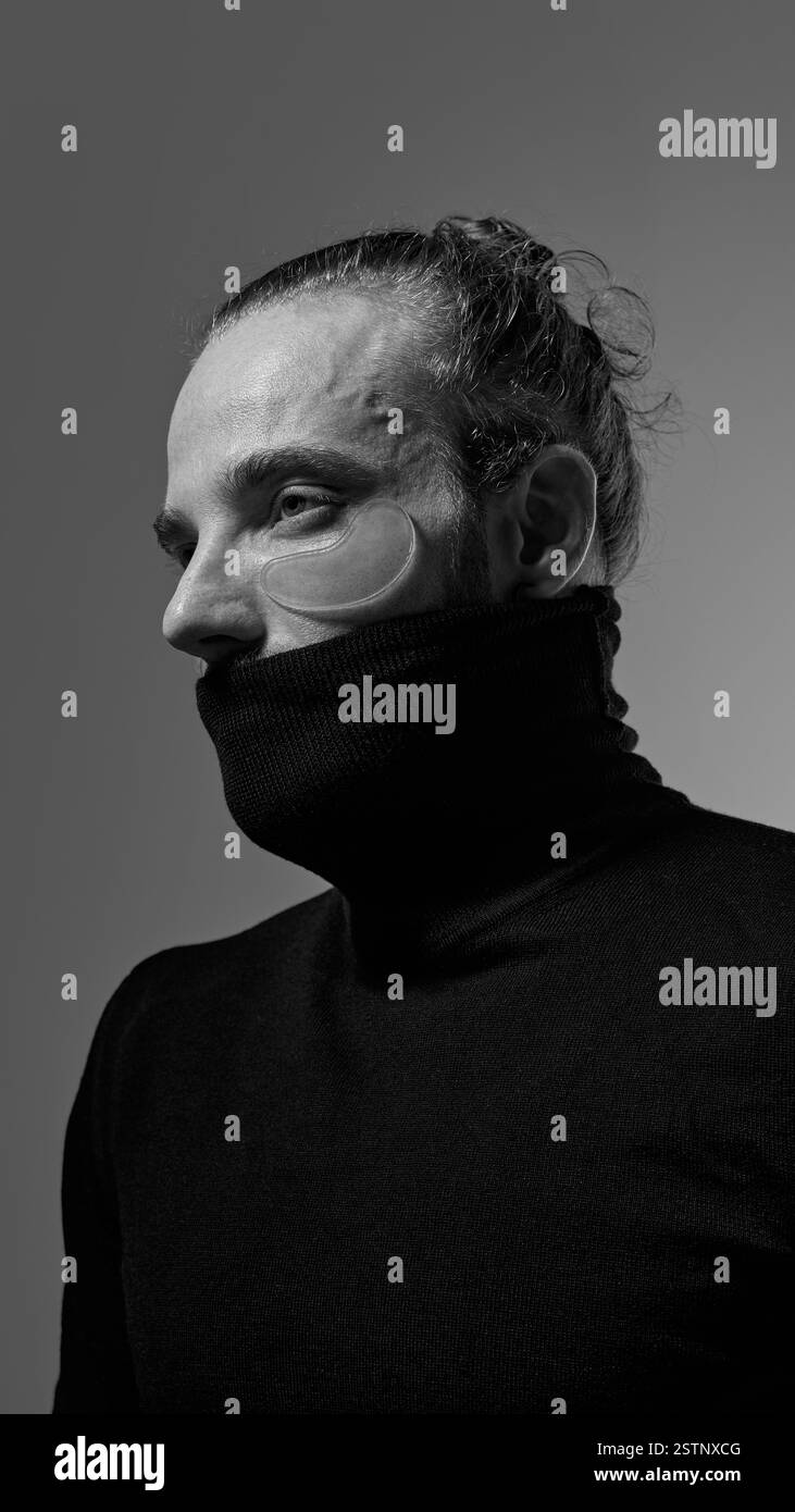Black and white portrait of handsome man in black turtleneck covering ...