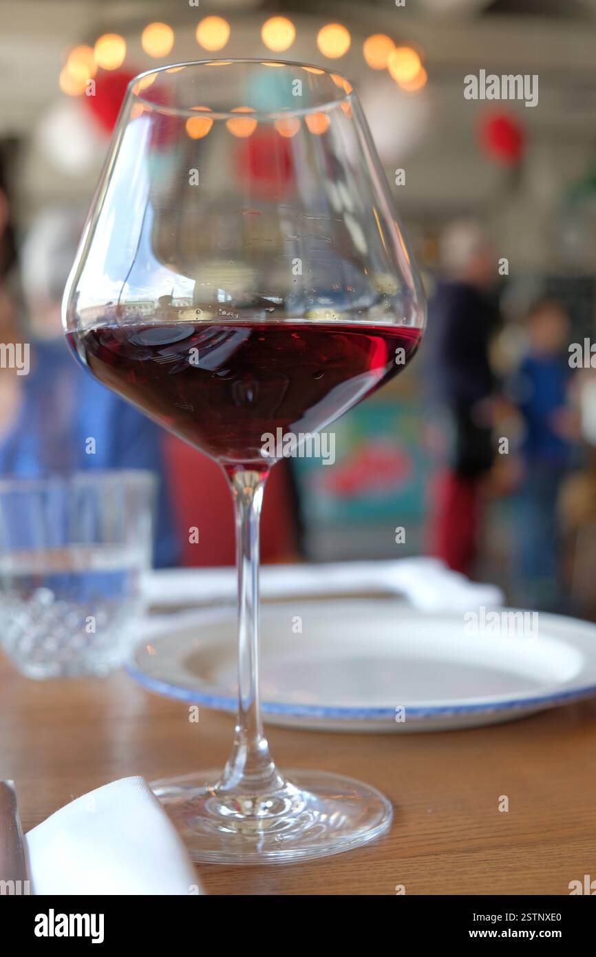 Low angle close-up shot of clear wine glass with traditional round ...