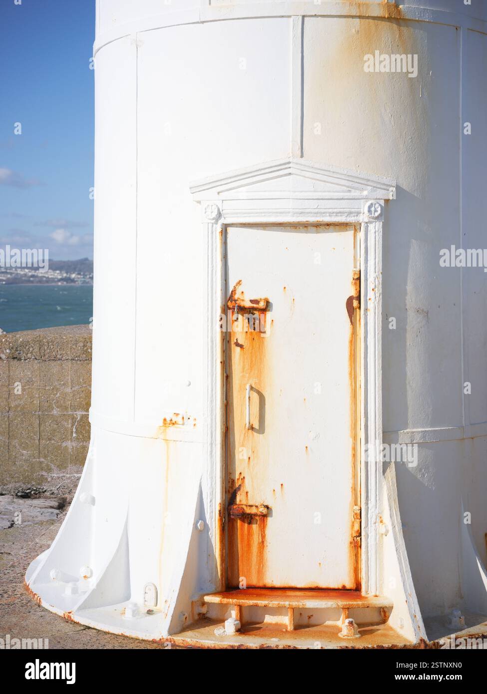 Rusty padlocked door of the lighthouse on the Breakwater pier at ...