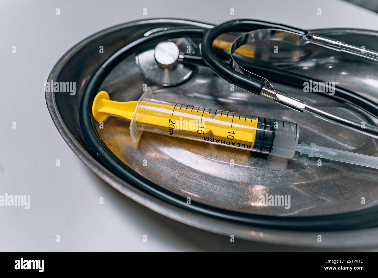 On the surgical tray is a syringe and a phonendoscope Stock Photo - Alamy