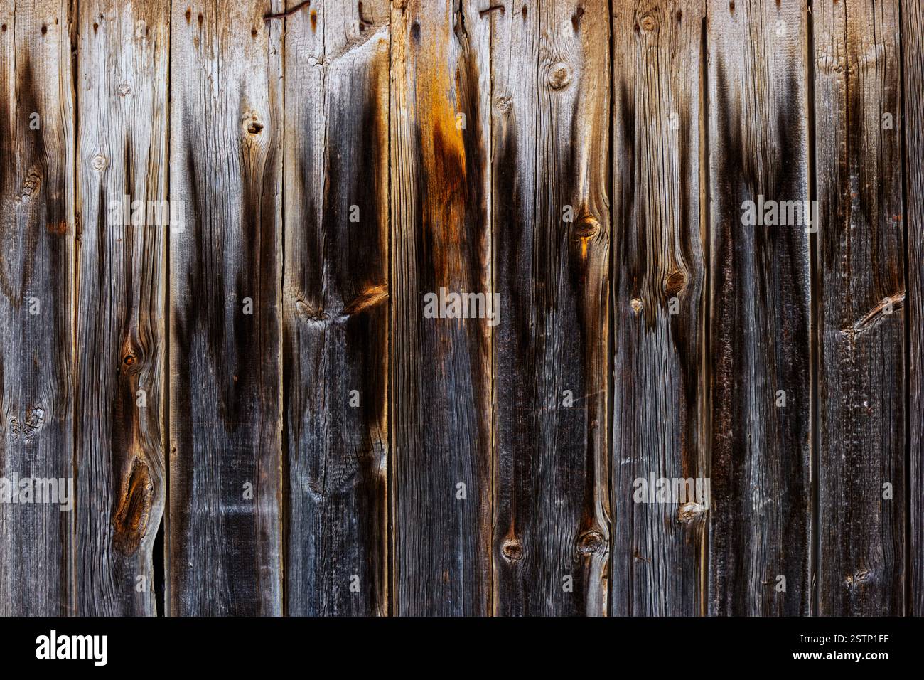 Aged Plank Fence With Footprint Of Fire Stock Photo - Alamy