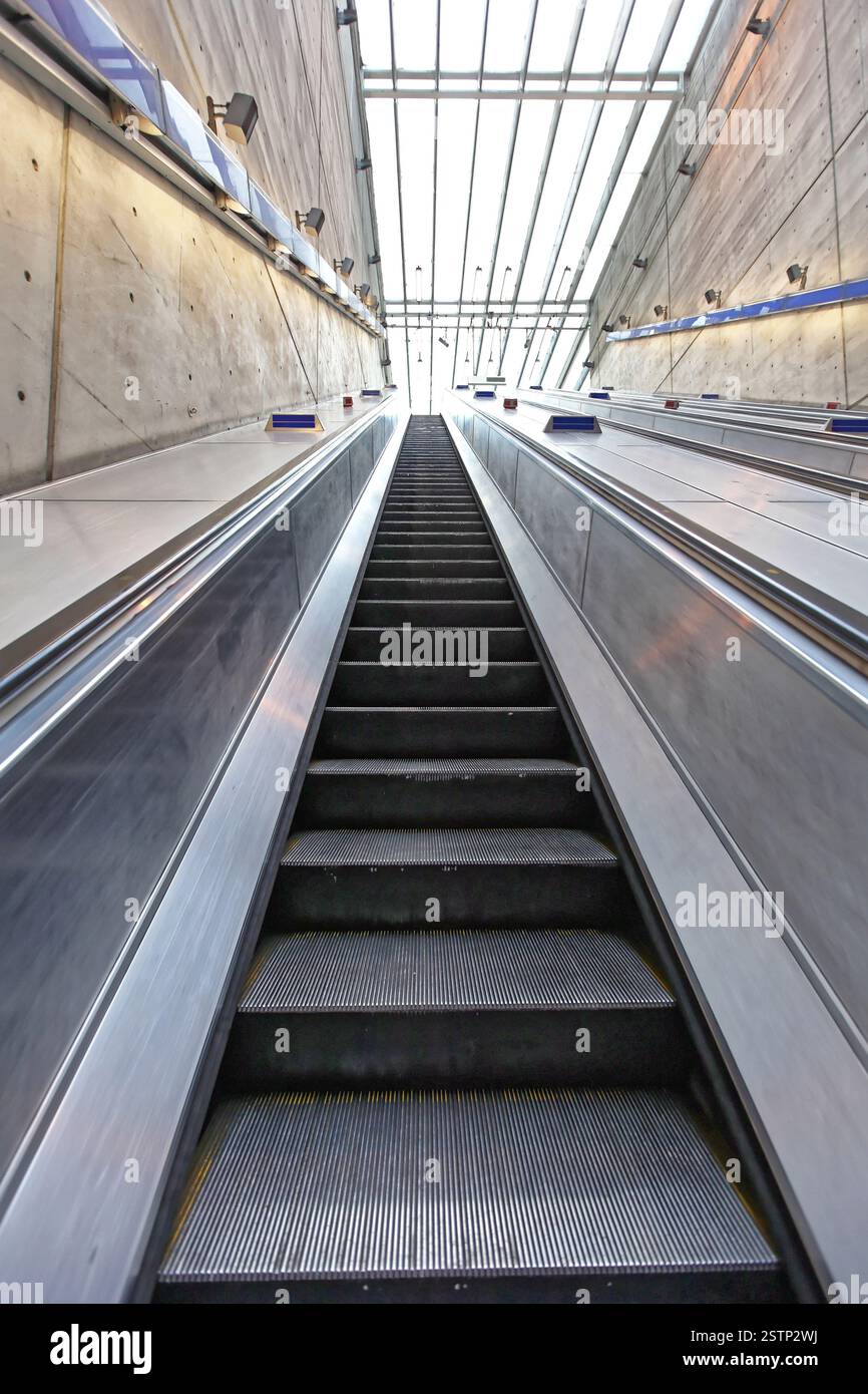 Long escalator conveyor in subway train station underground hi-res ...