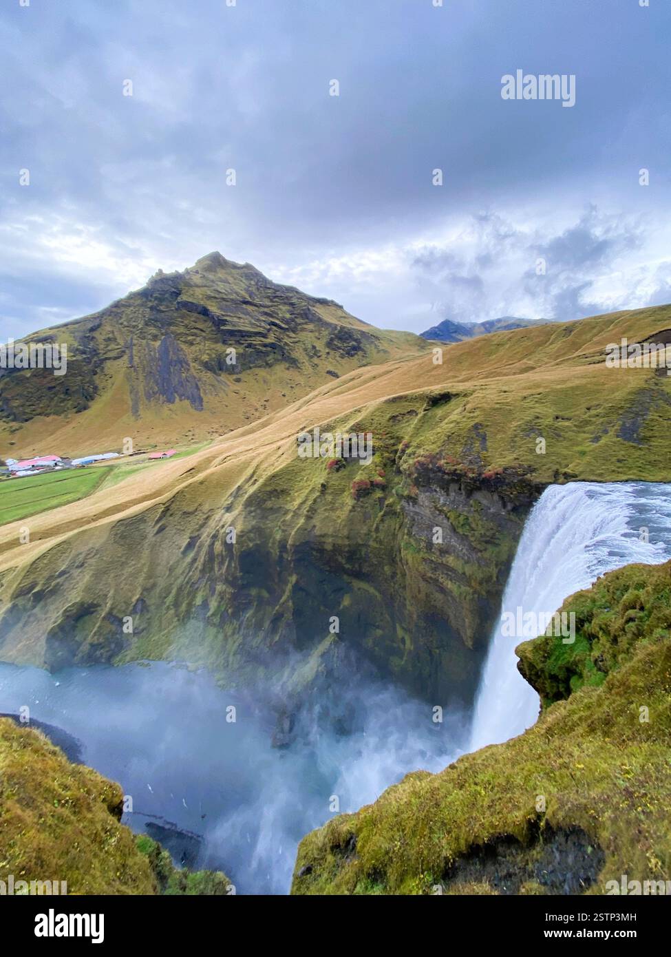 The photo captures a breathtaking view of a waterfall likely ...