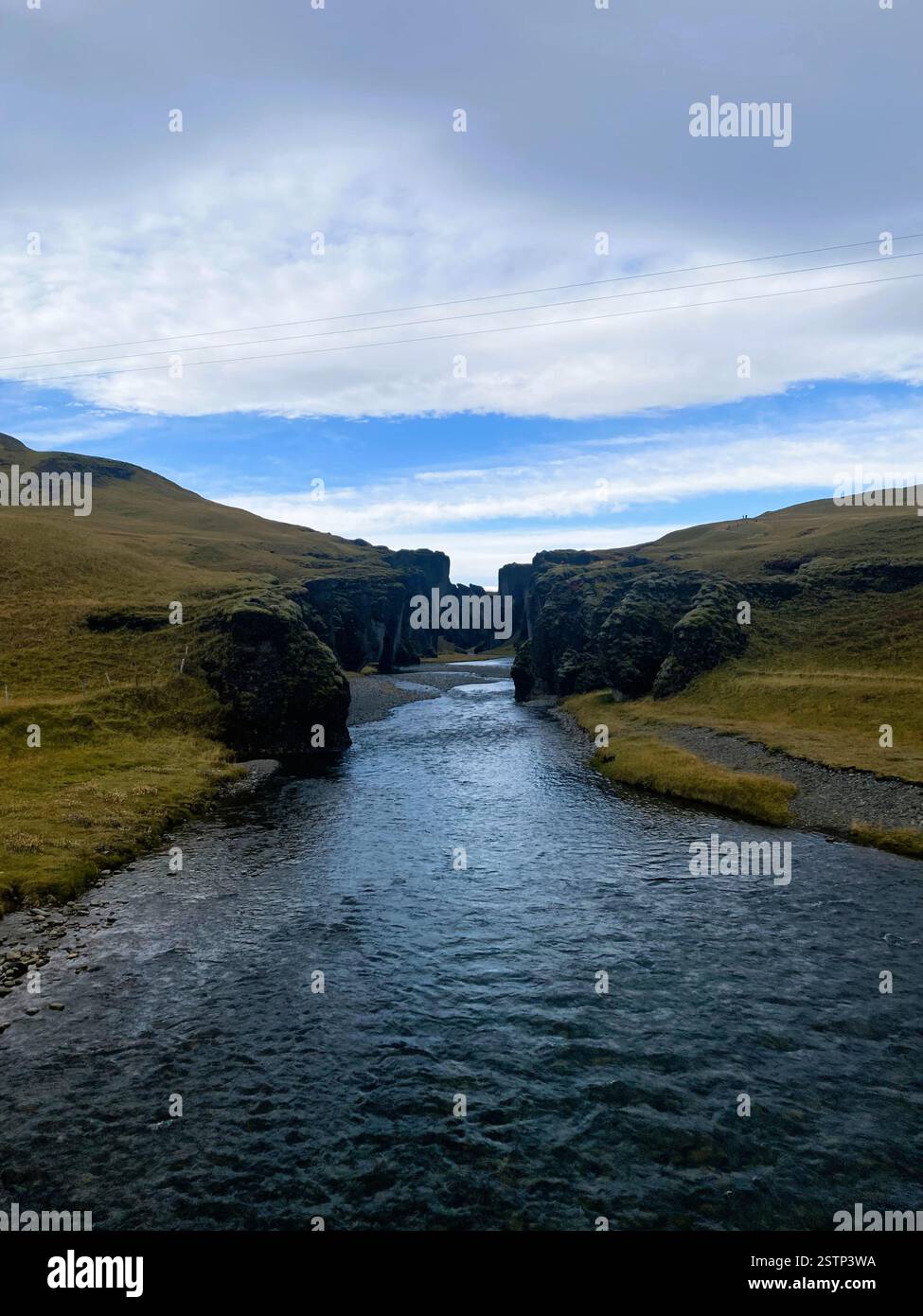 The photo captures a stunning natural landscape featuring a serene ...