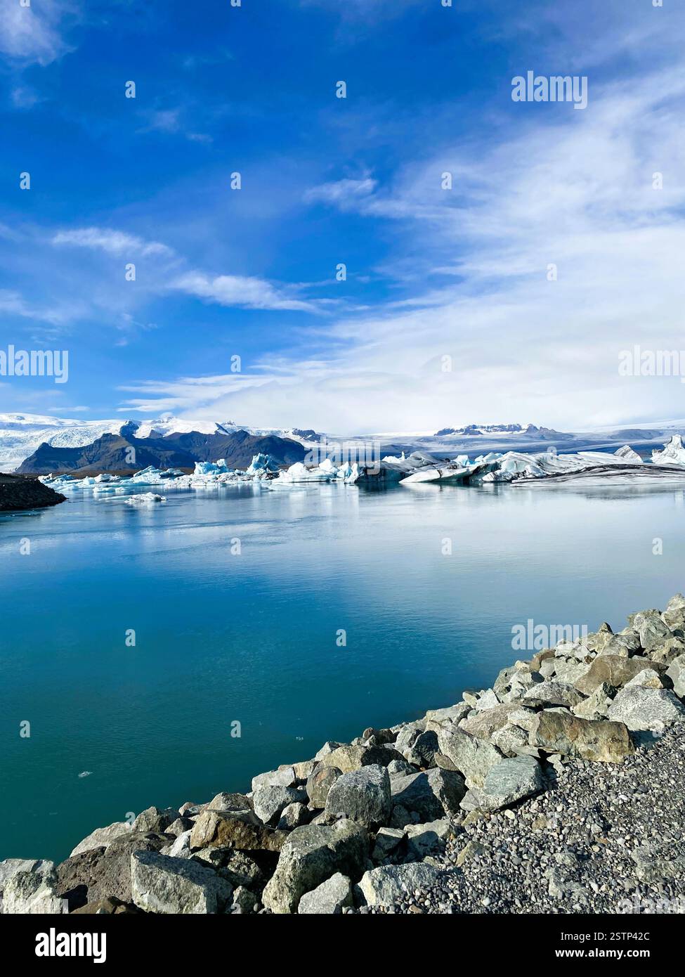 The photo captures a stunning landscape featuring a serene glacial ...