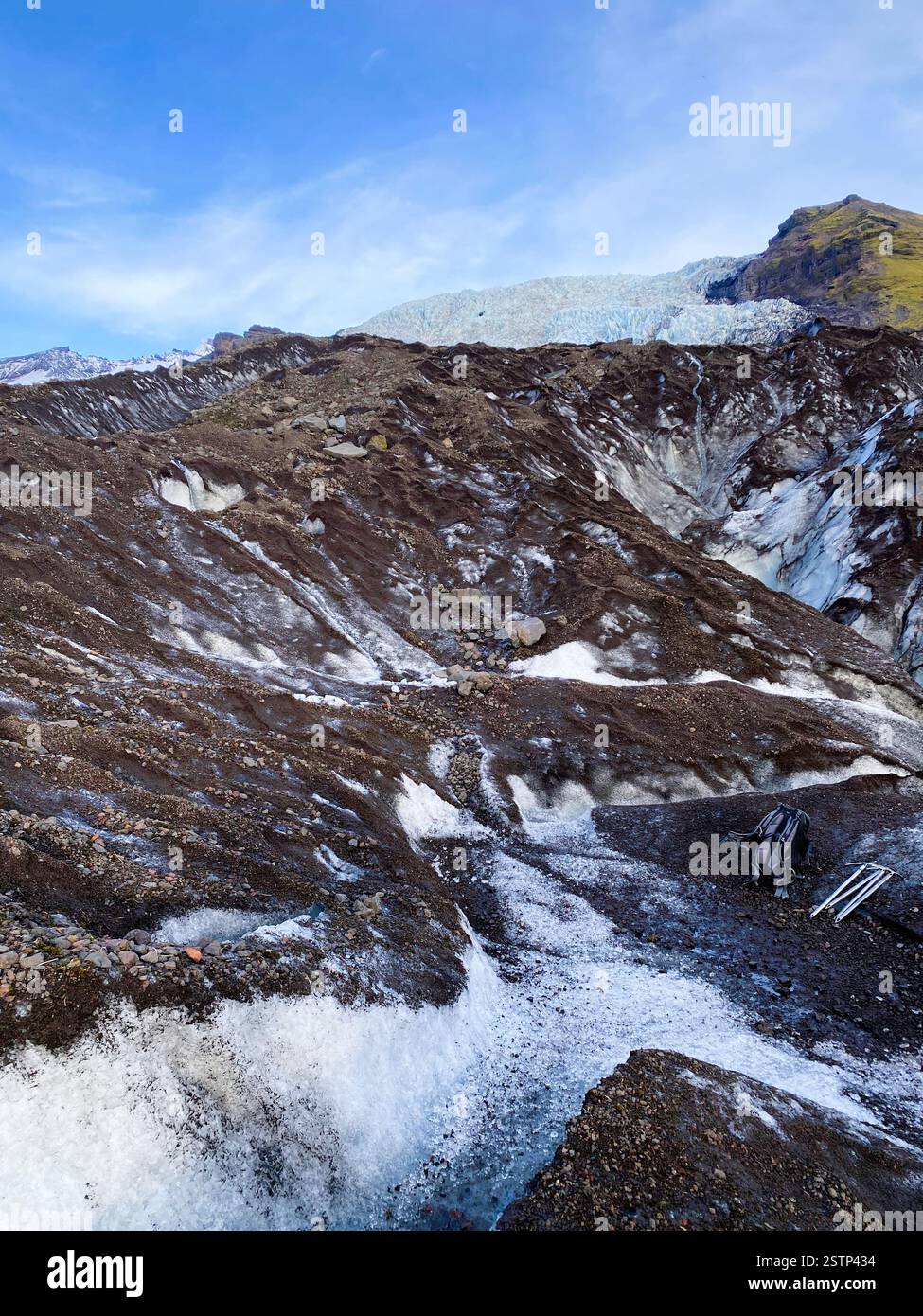 A glacial landscape with steep terrain, a large glacier, and hiking ...