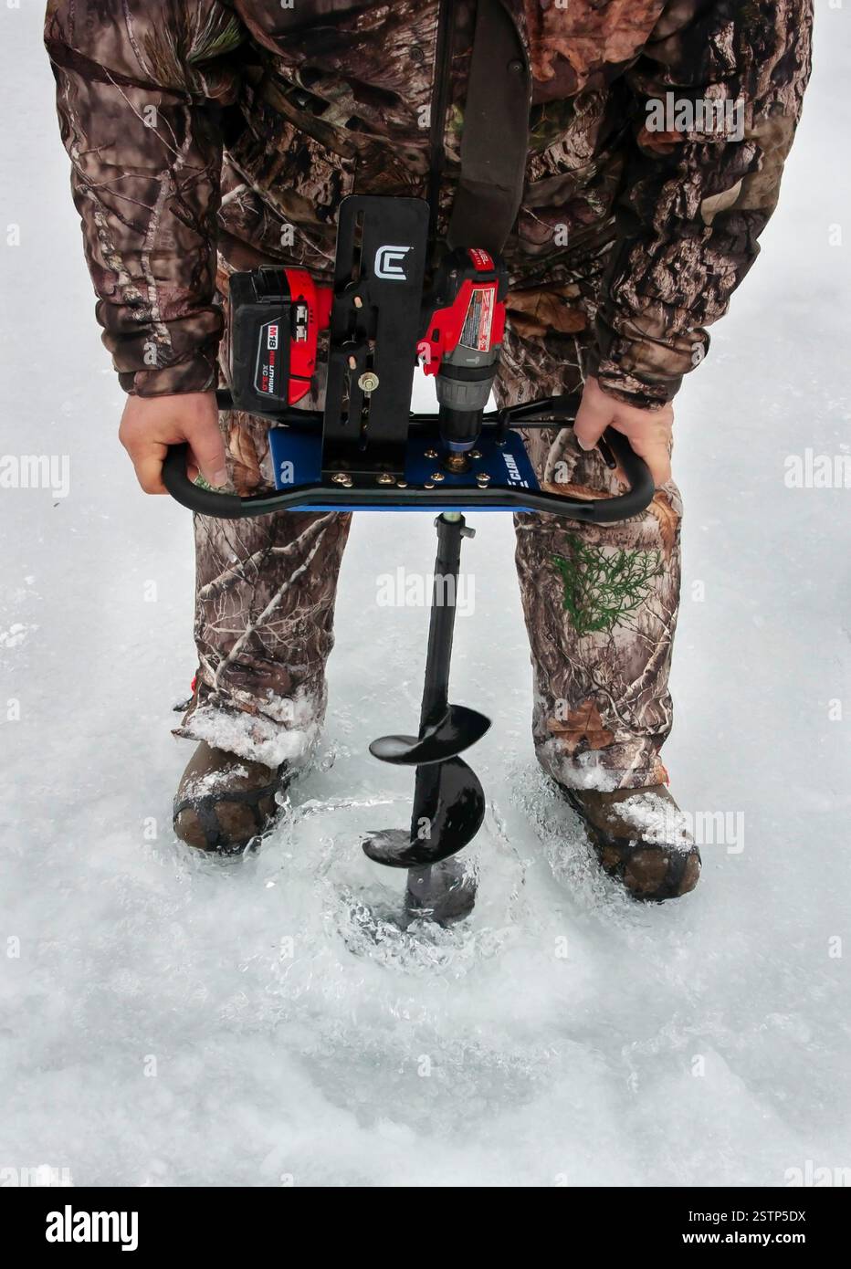 Fishing through frozen hole hi-res stock photography and images - Alamy
