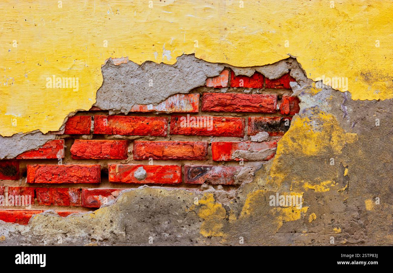 Building wall with half broken palster Stock Photo - Alamy