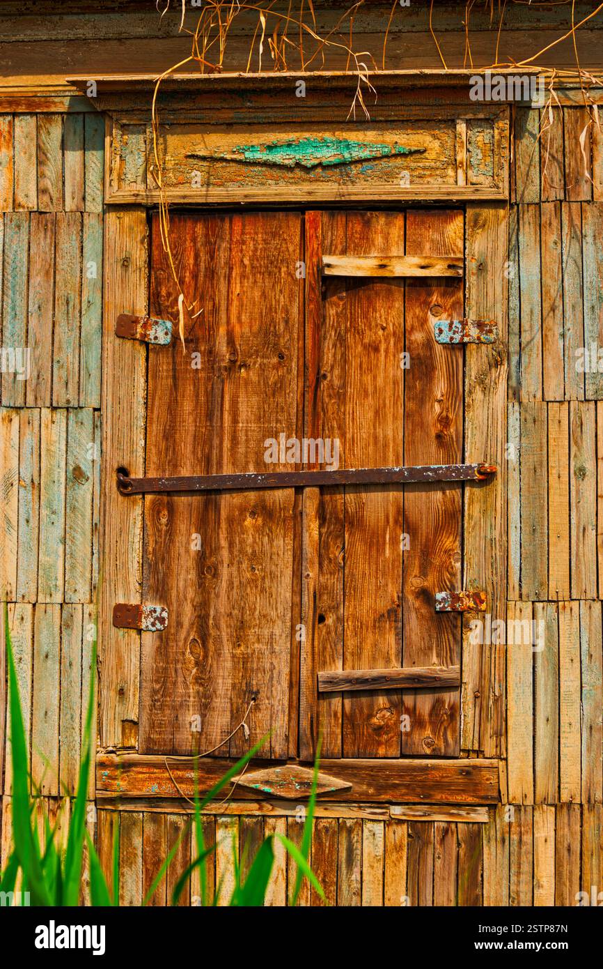 Closed wooden window of slum house front view Stock Photo - Alamy