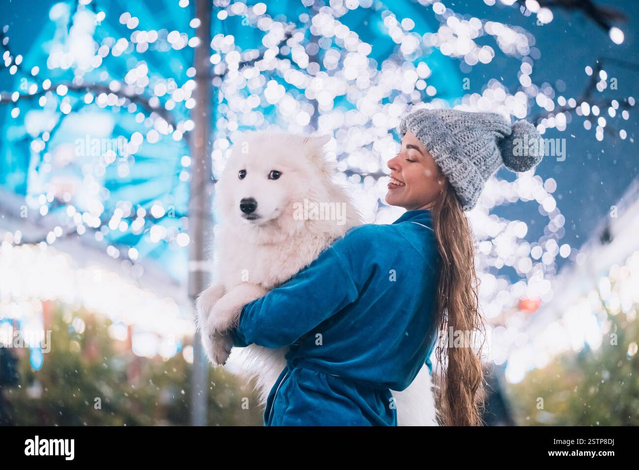 Woman carries dog in arms hi-res stock photography and images - Alamy