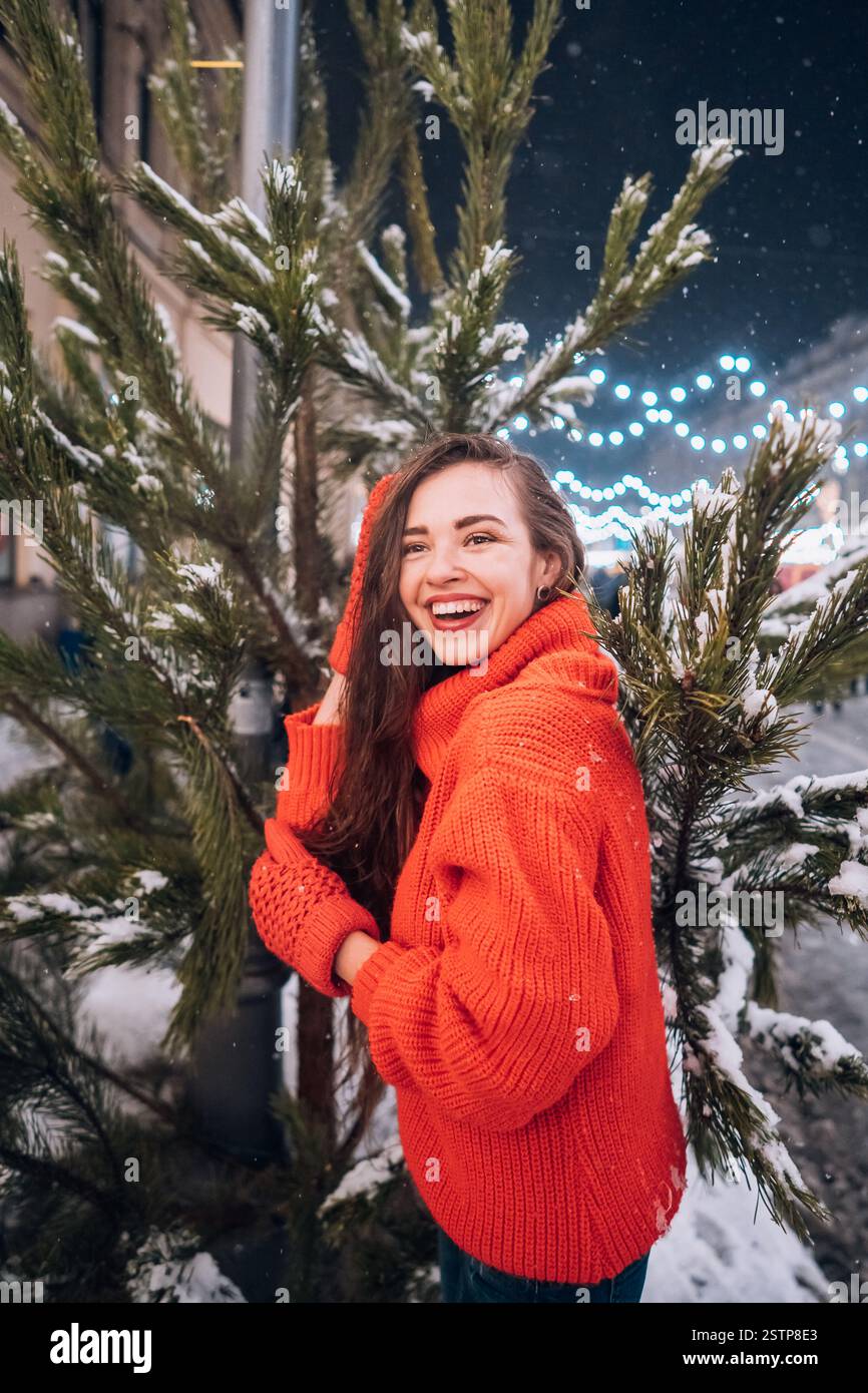 Pretty woman near christmas tree hi-res stock photography and images ...