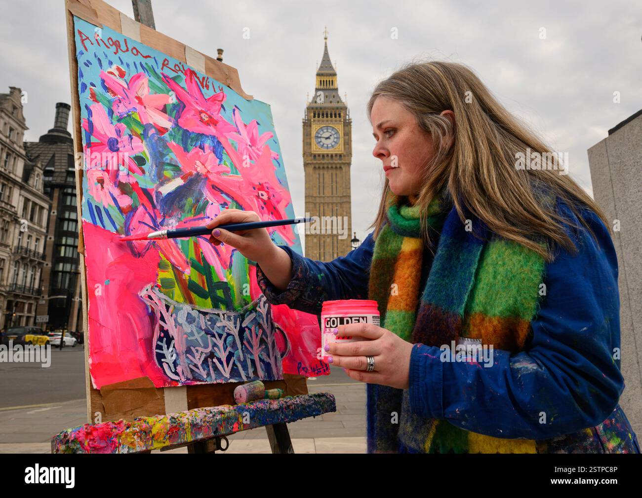 EDITORIAL USE ONLY Artist Emily Powell paints outdoors in front of the ...