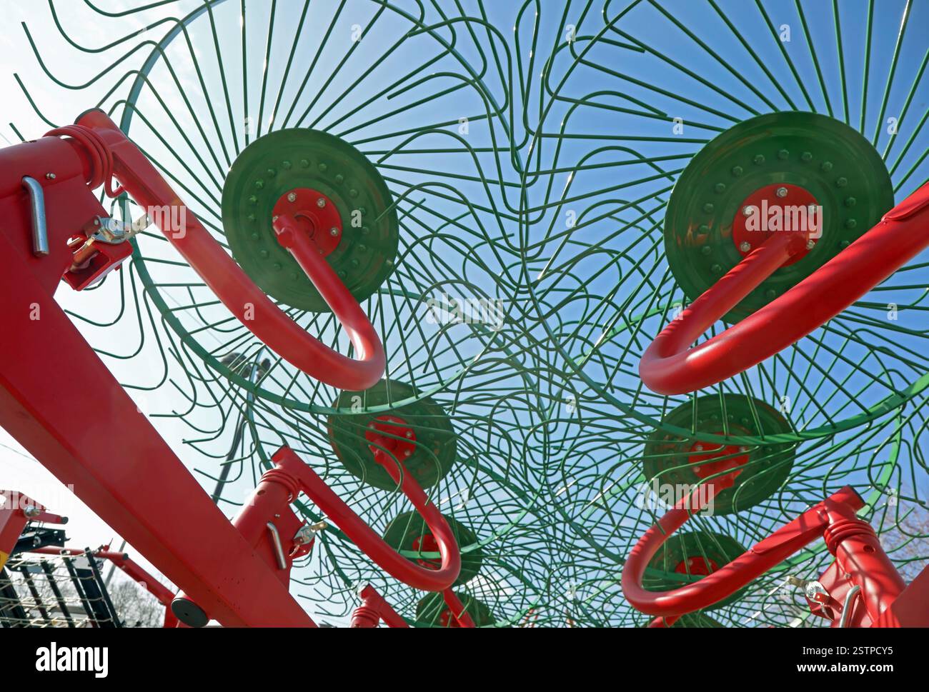 agricultural machine, commonly called a rotary tiller or aerator, seen ...