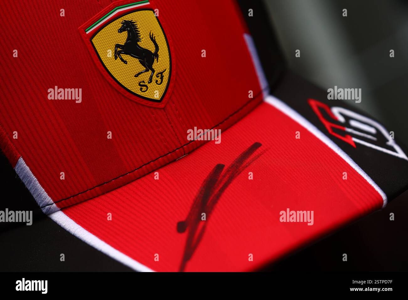 Modena, Italy. 19th Feb, 2025. A cap signed by Lewis Hamilton during ...