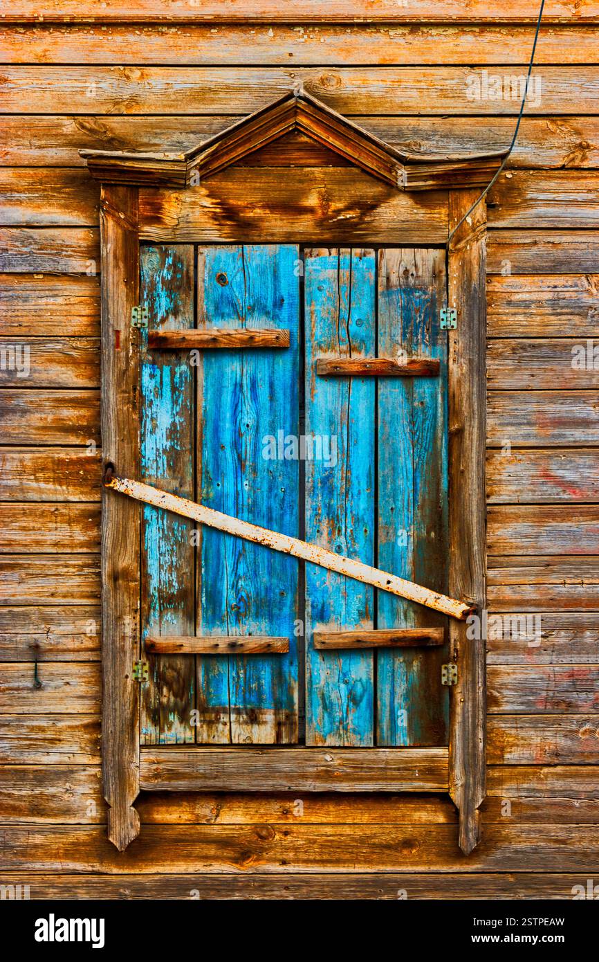 Weathered wooden window in slums painted in peeling blue paint Stock ...