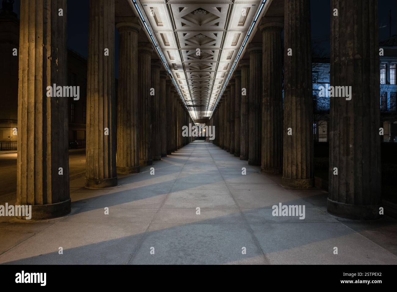 Colonnade receding into the distance. Evening illumination Stock Photo ...