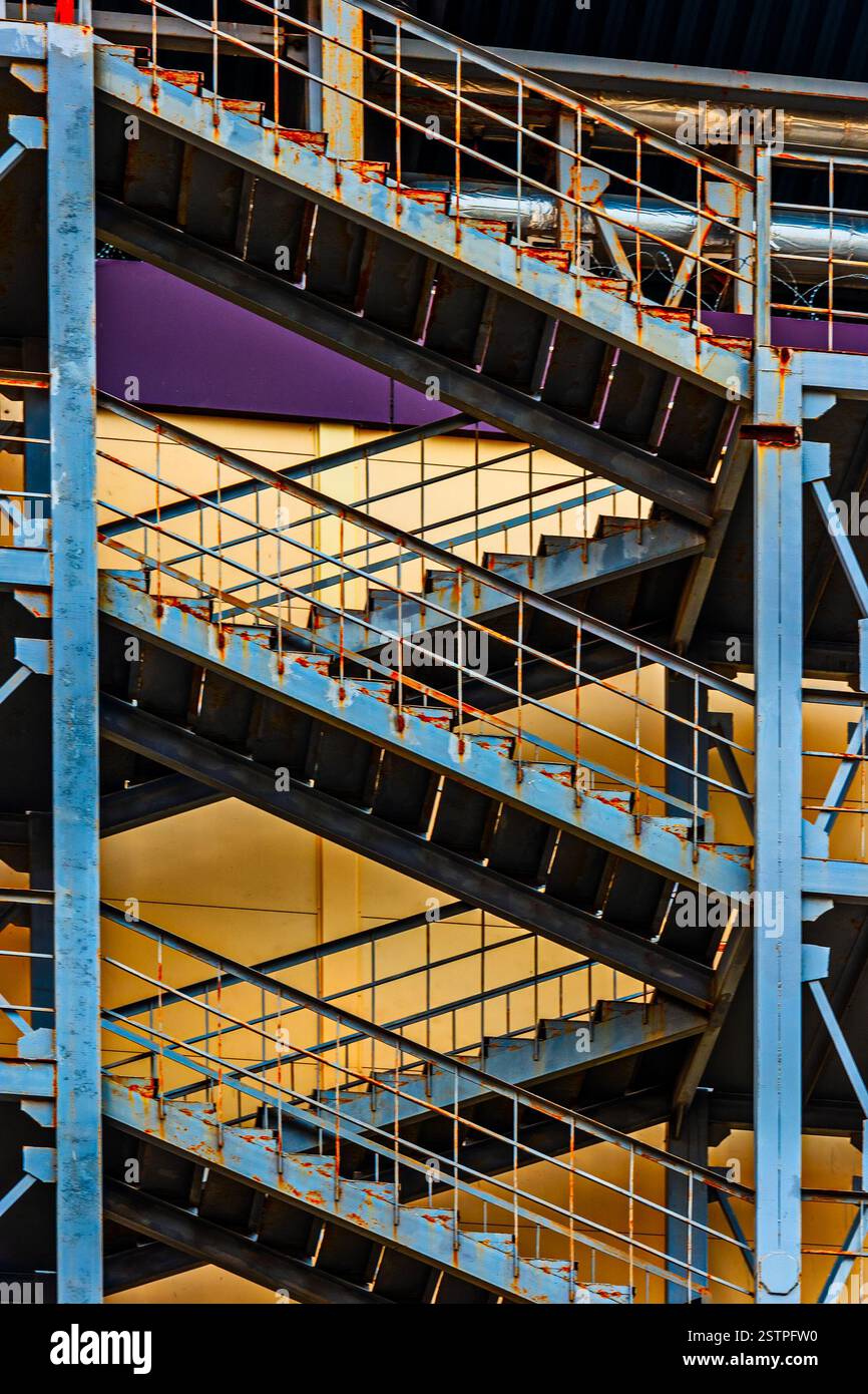 Outside metal fire escape stairs. Metal fire escape stairs mounted on ...